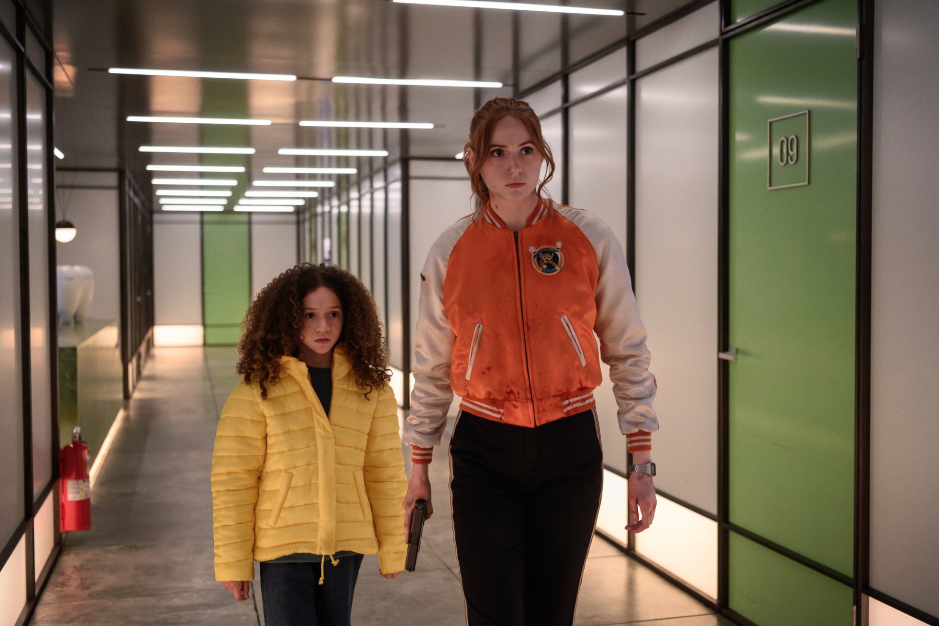 Gunpowder Milkshake HD: Chloe Coleman & Karen Gillan Action Duo Wallpaper