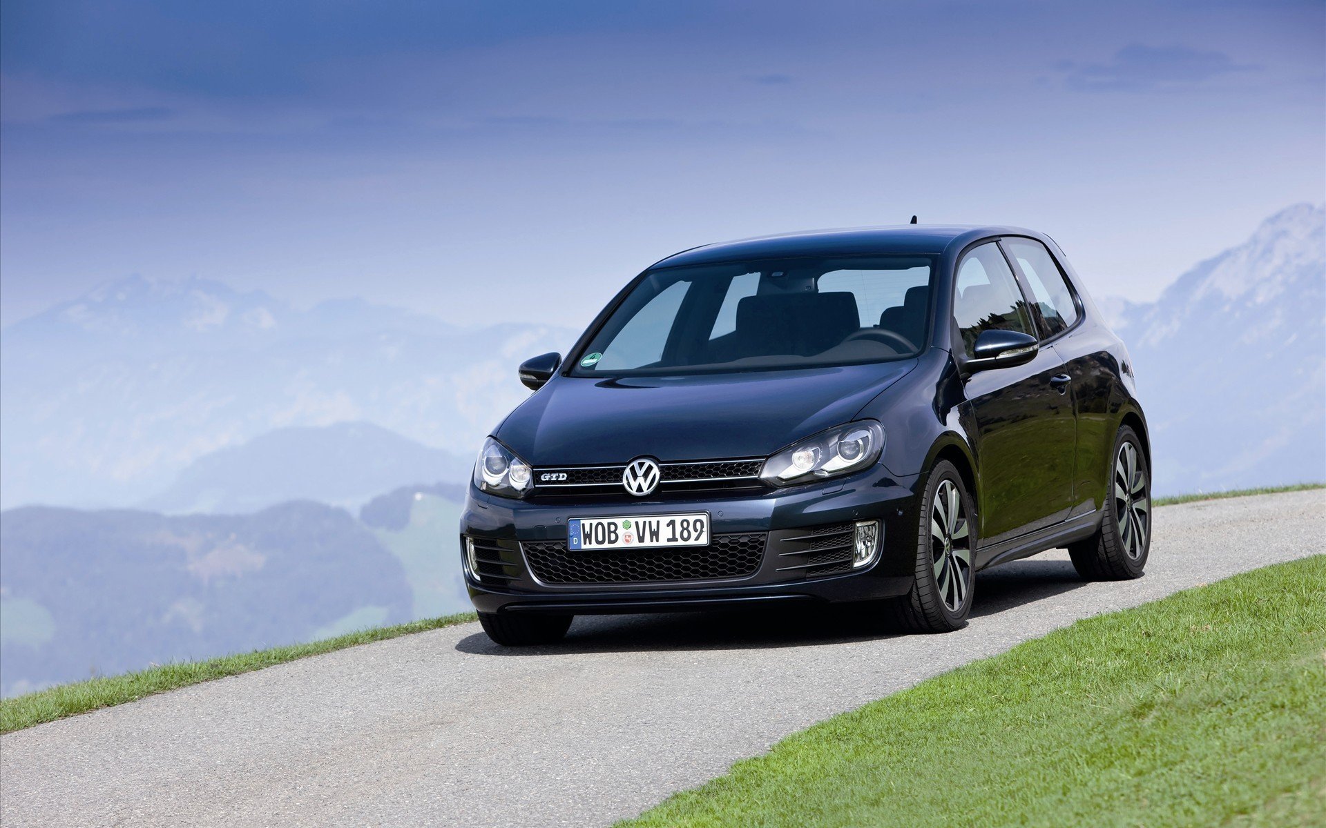 Volkswagen Golf HD Wallpaper – Sleek Drive on Scenic Road