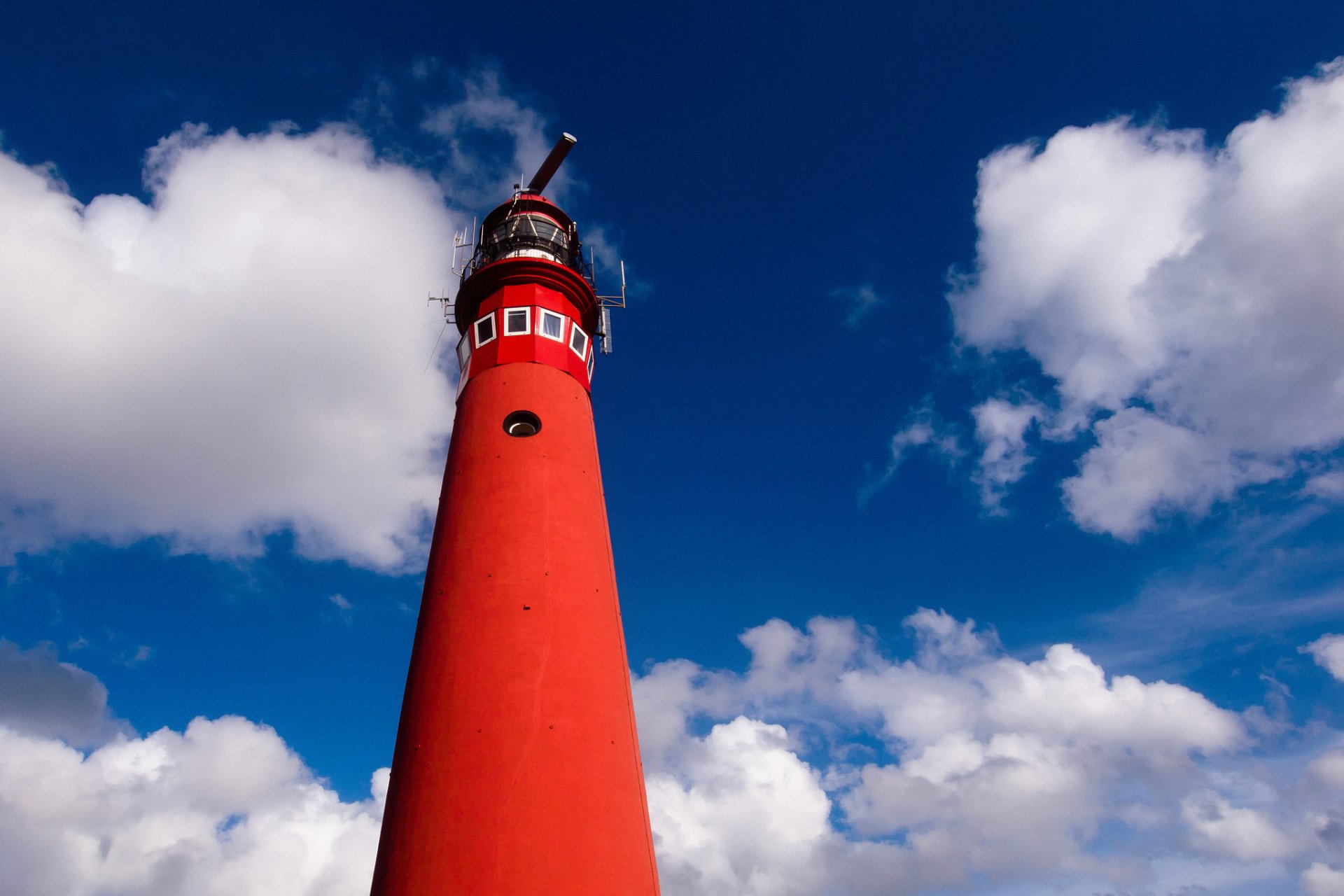 HD Wallpaper of a Striking Red Lighthouse Against a Blue Sky ...