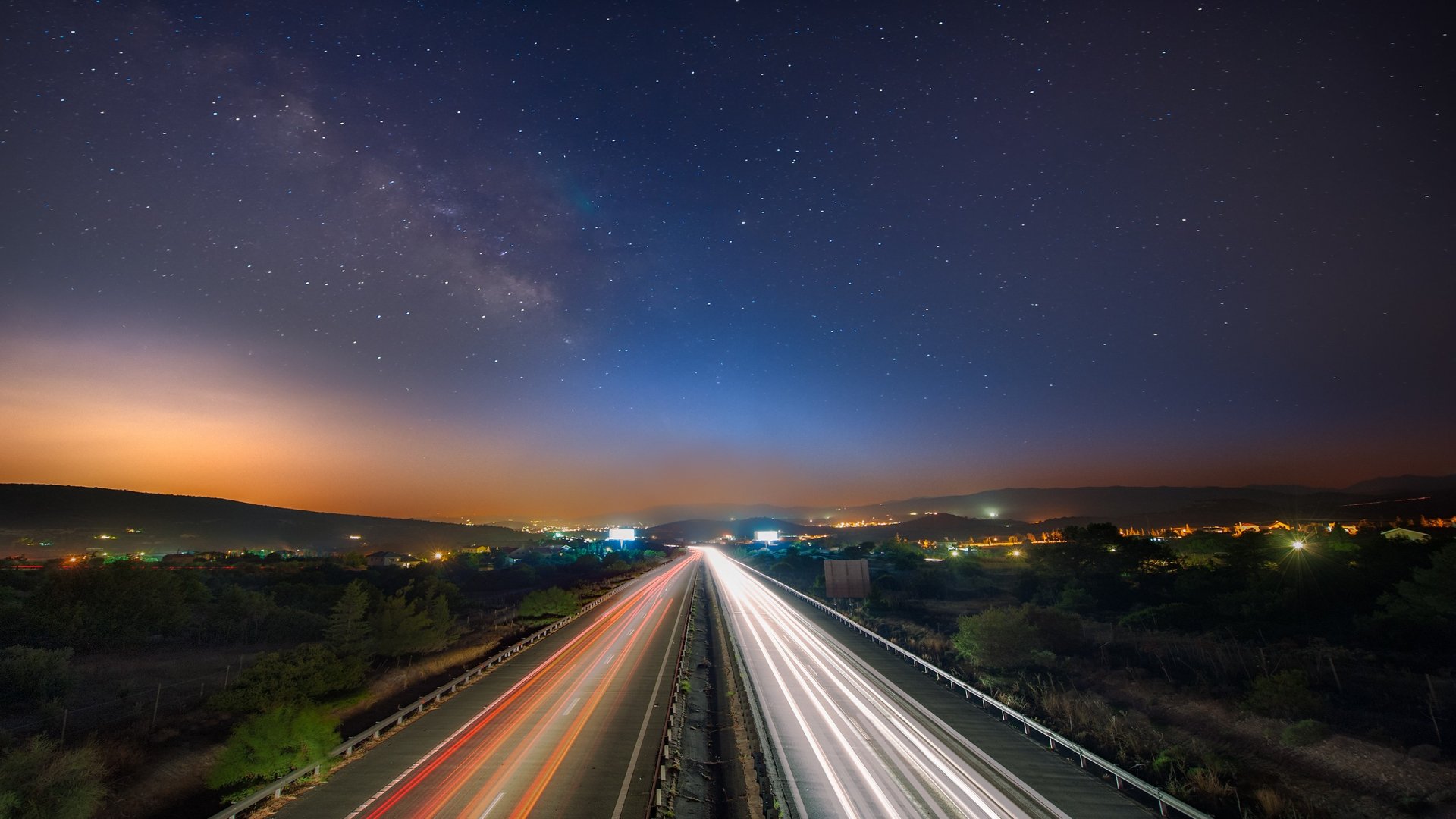 Starlit Highways: Stunning HD Time-Lapse Photography Wallpaper