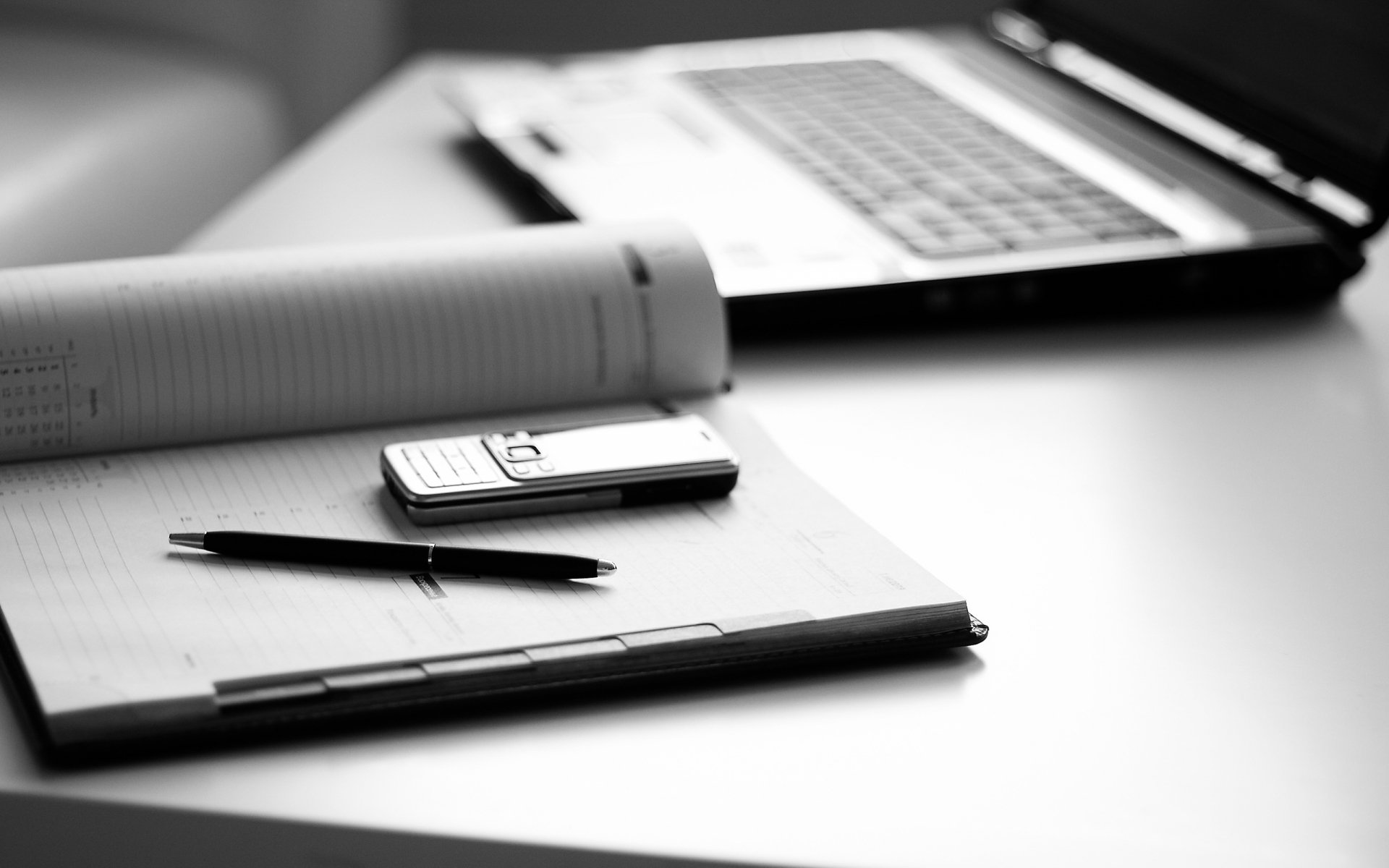 Tech Essentials: Sleek Phone & Laptop HD Workspace Wallpaper