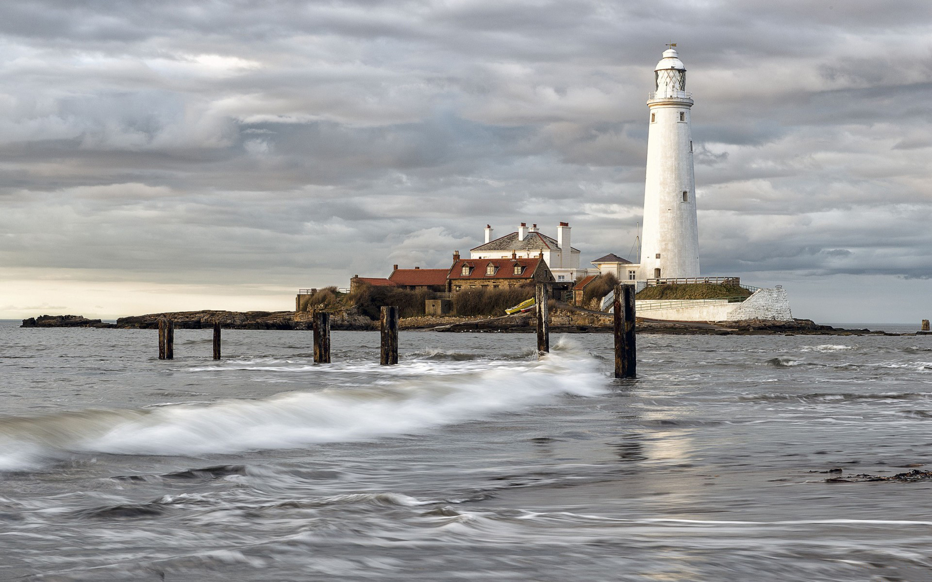 HD Lighthouse Serenity: Man-Made Beacon Against Moody Skies