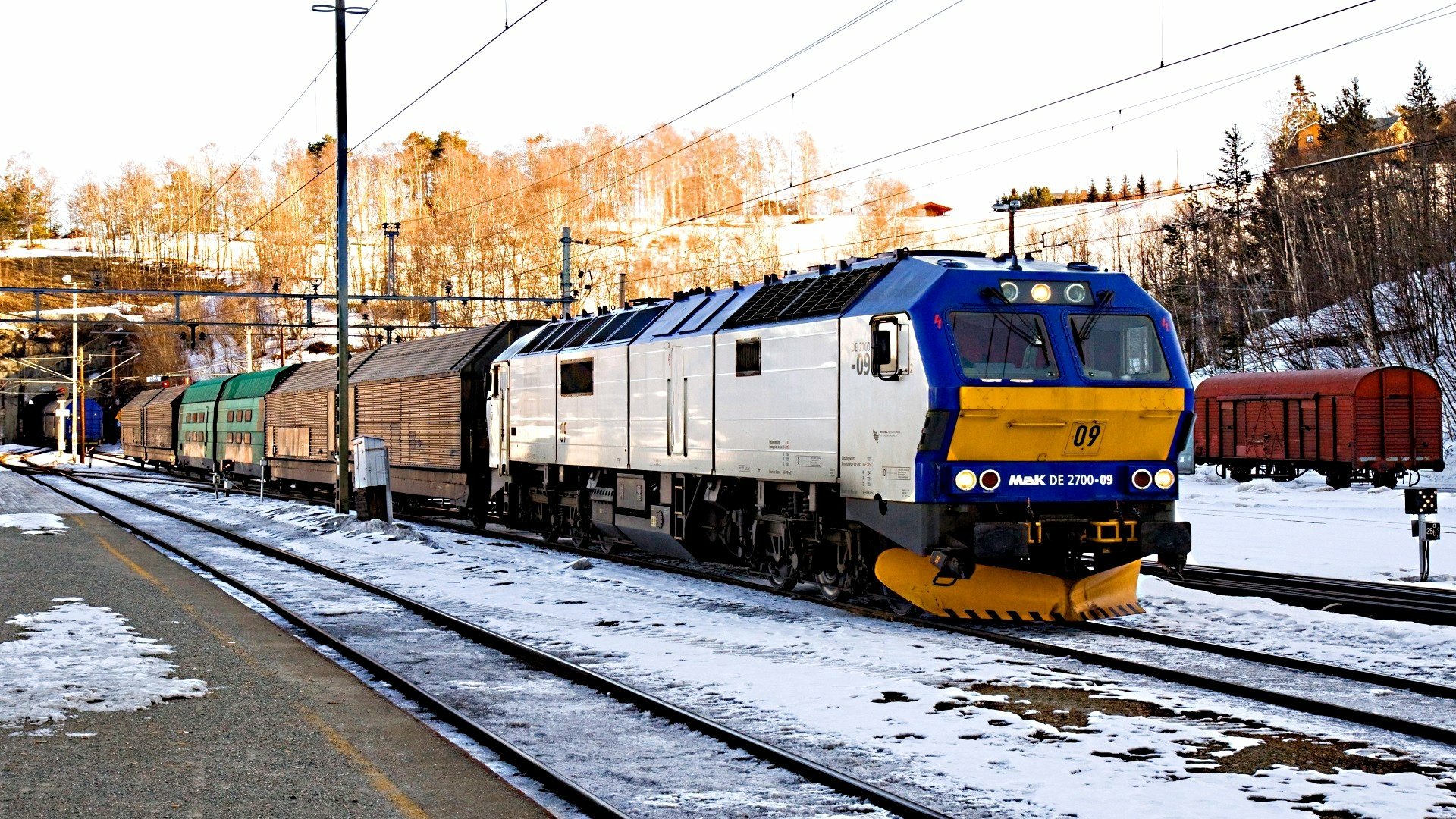 HD Wallpaper: Modern Freight Train Powering Through Winter Tracks ...