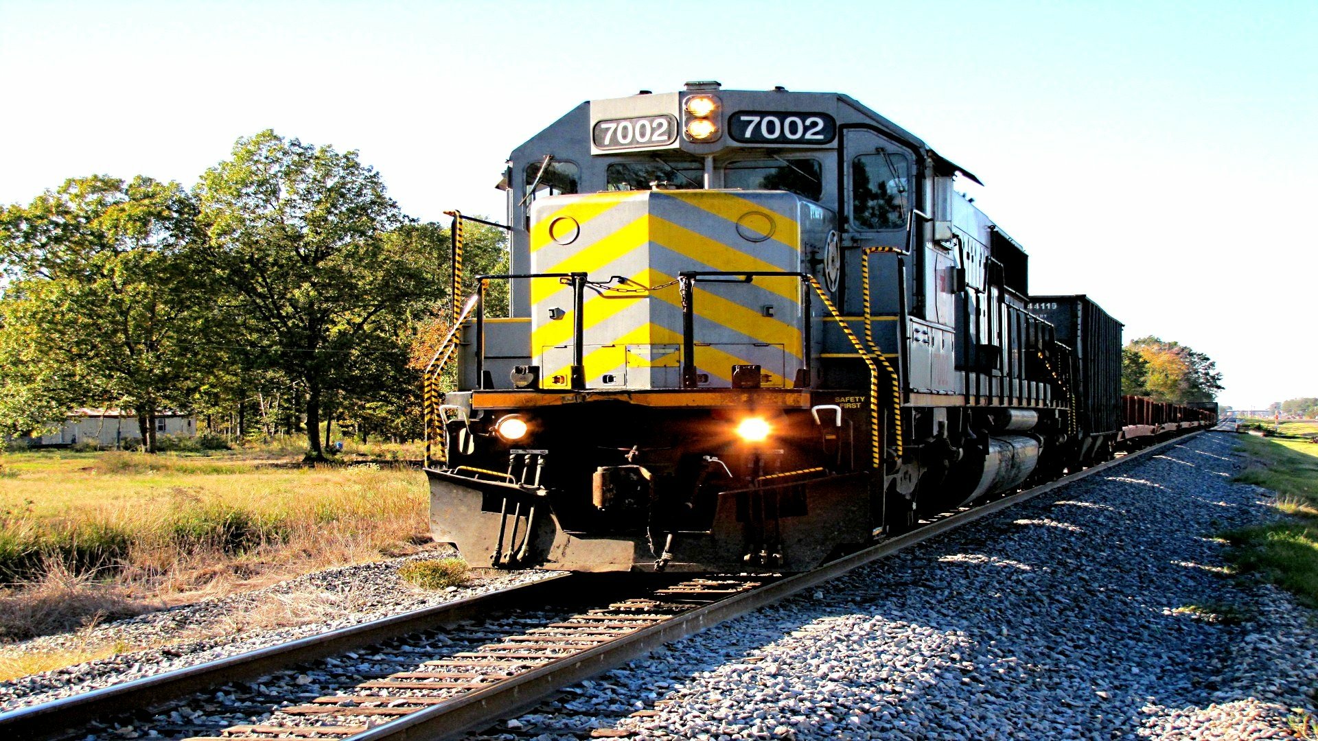 HD Train Journey: Powerful Locomotive on Open Tracks Wallpaper