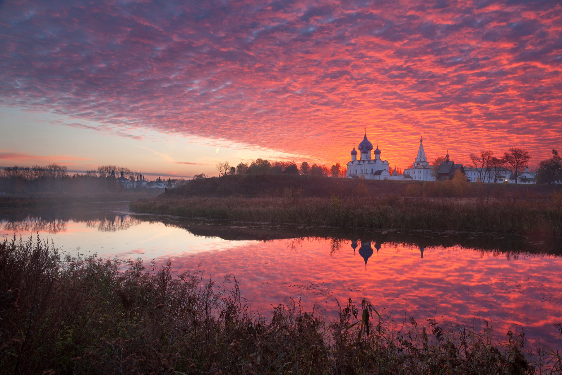 Suzdal Dawn: Sunrise Over Church and River Reflections