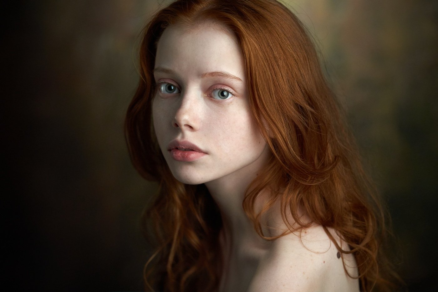 Radiant Redhead Beauty: HD Portrait of Long-Haired Woman Model by Alexander Vinogradov
