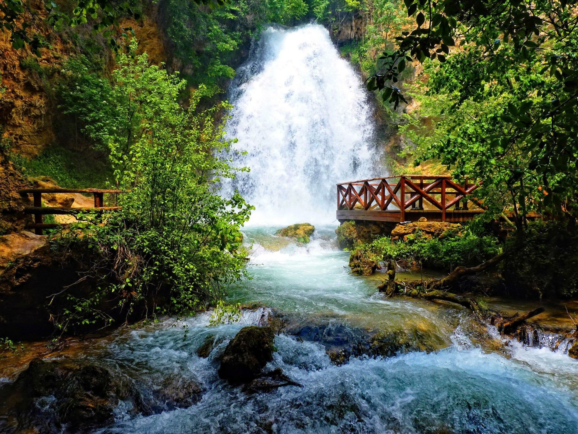 Serenity in Nature: HD Wallpaper of a Waterfall Oasis
