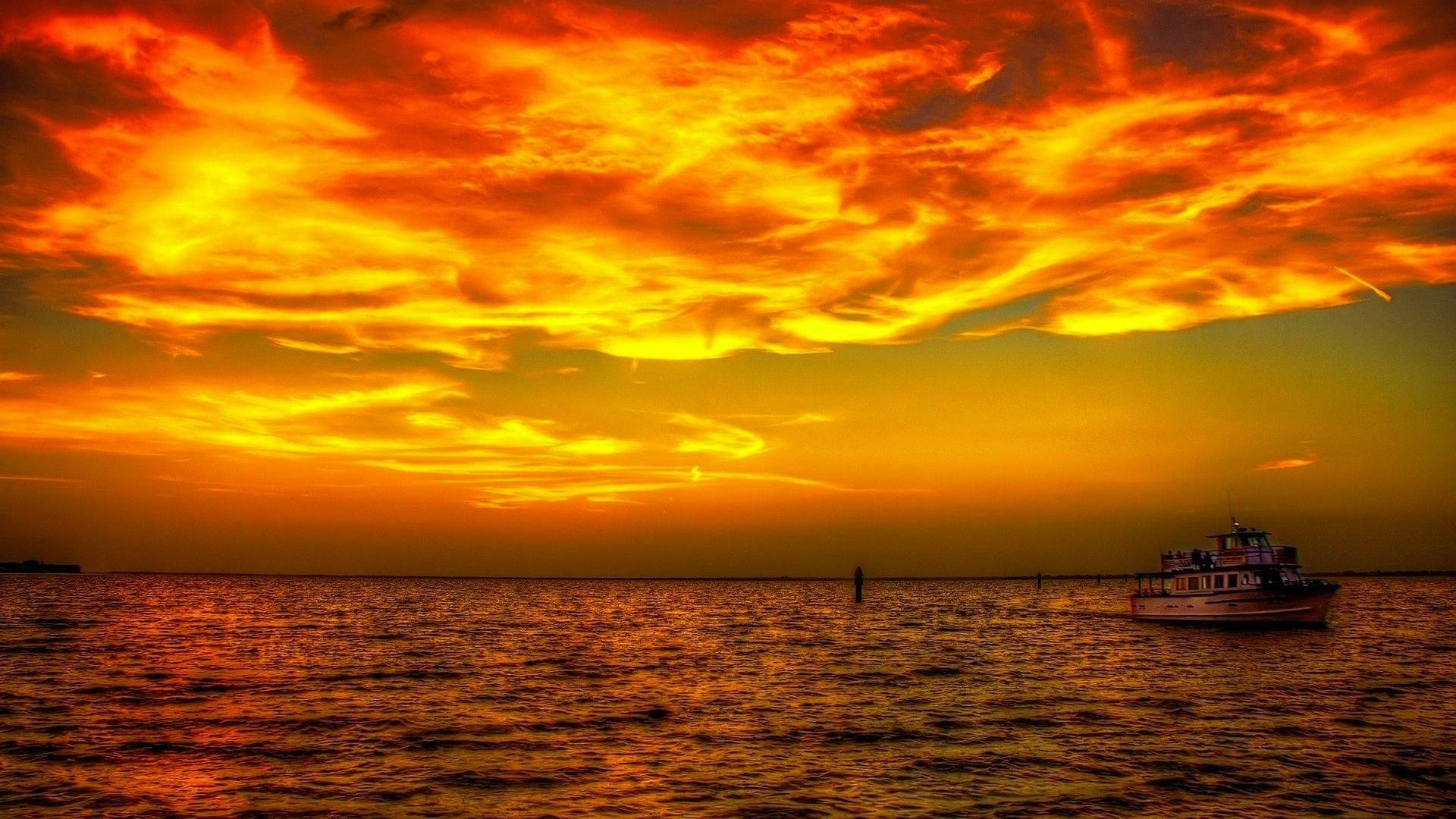 Radiant Sunset Horizon: HDR Boat Glide Through Golden Skies