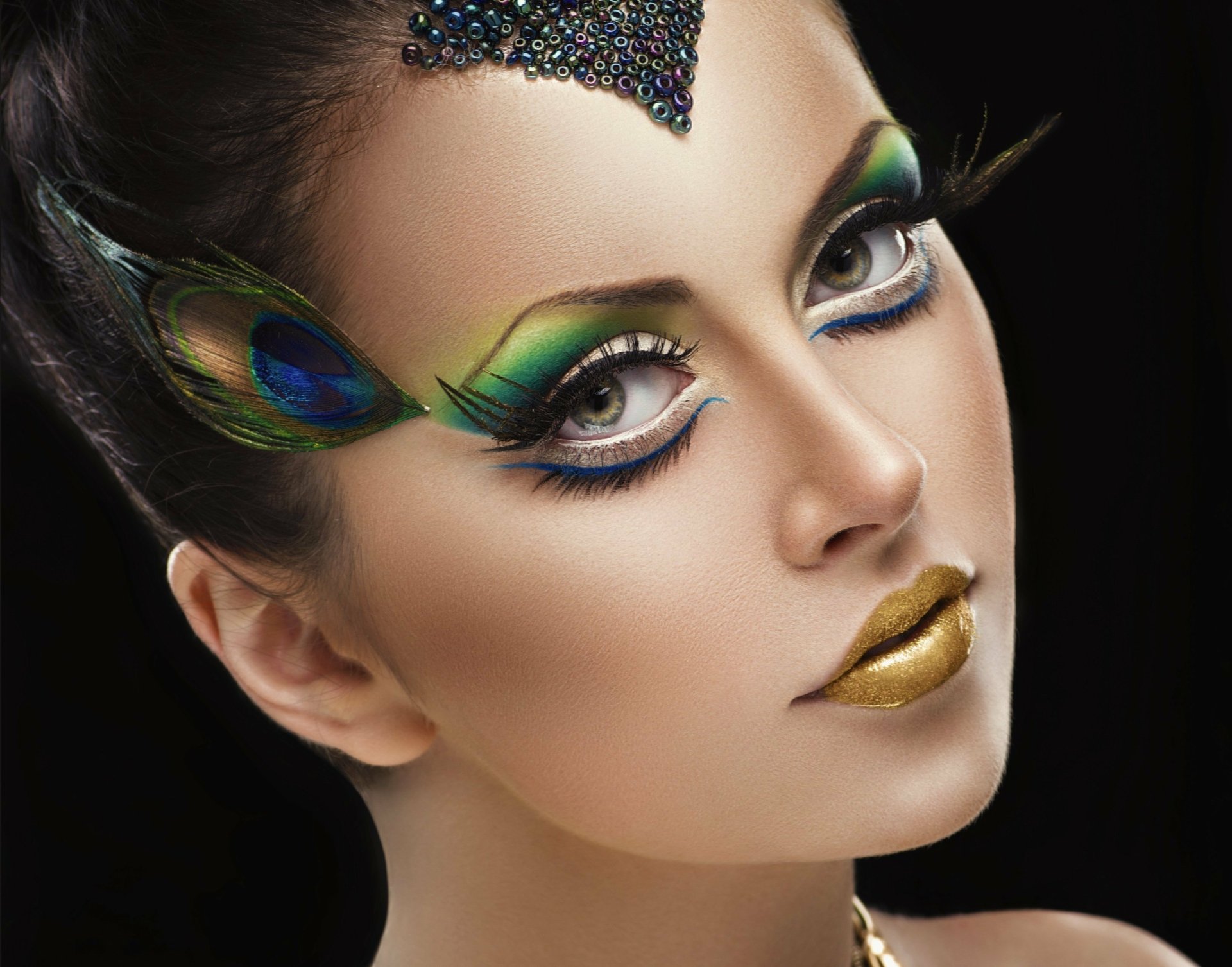 Enigmatic Brunette with Peacock Feather Makeup and Mesmerizing Green Eyes