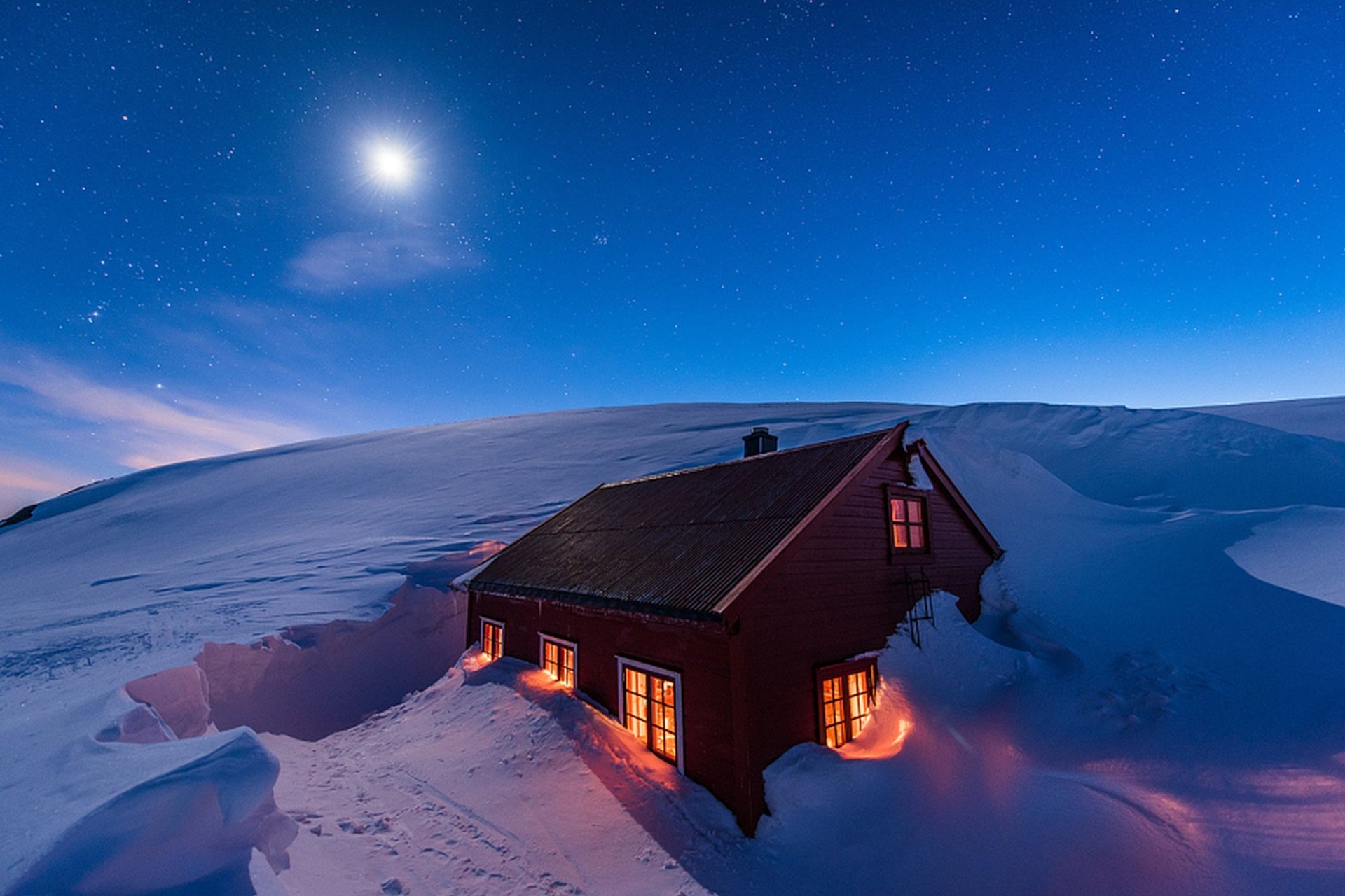 Winter Haven: A Cozy Man-Made Home Beneath the Snowy Moonlight by Espen ...