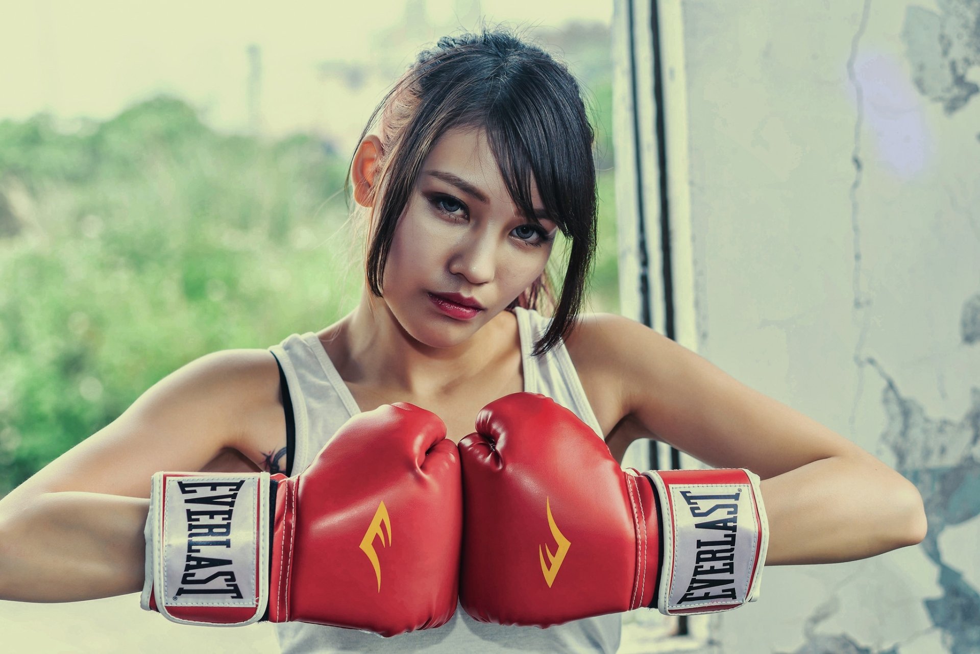 Fierce Asian Boxer with Striking Blue Eyes – HD Sports Wallpaper