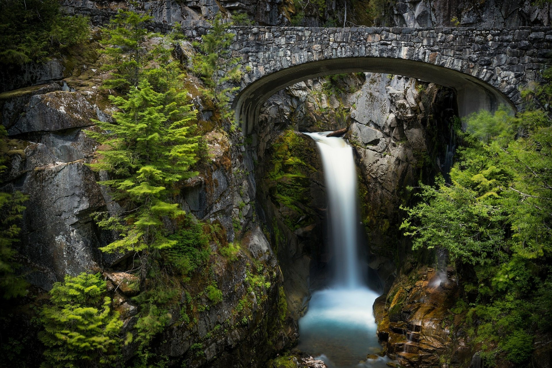 Timeless Stone Bridge Over Serene Waterfall in Lush Nature - HD Wallpaper
