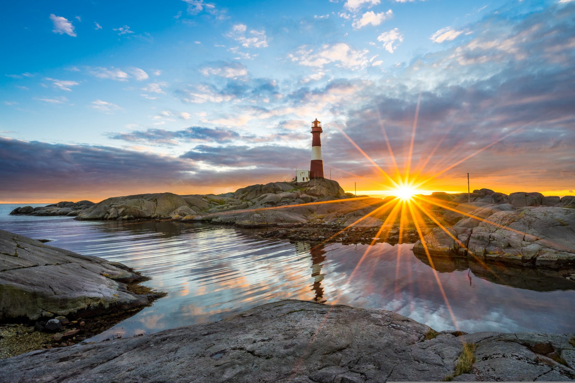 Sunrise Radiance Over Lighthouse and Cloud-Kissed Sky – HD Wallpaper